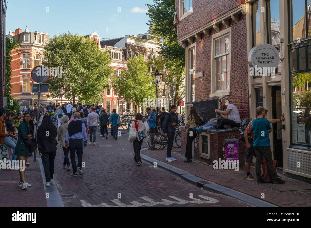 People strolling through a pleasant street - the 9 streets, a ...
