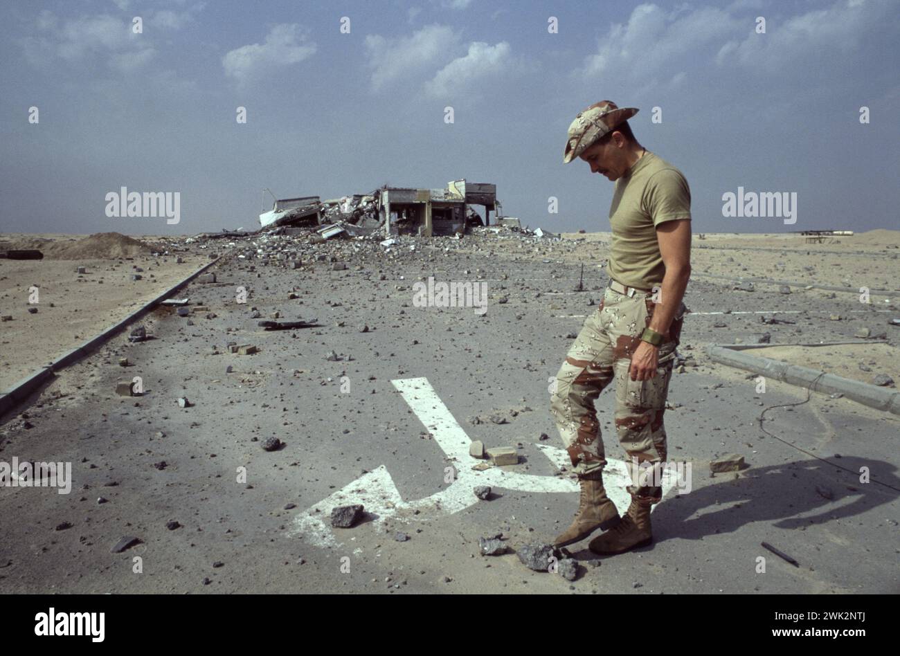 First Gulf War: 15th March 1991. A coalition soldier examines debris ...
