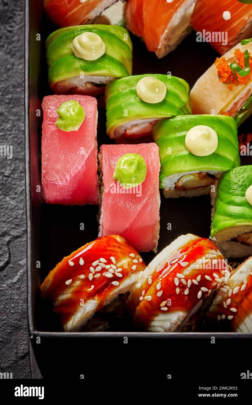 Colorful set of various Japanese rolls with tuna, salmon, eel, avocado ...