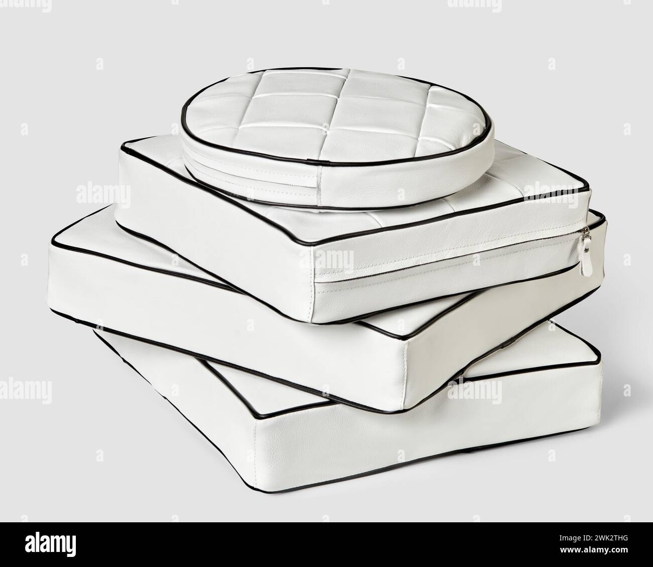 Stack of minimalist square and round white leather seat cushions Stock ...