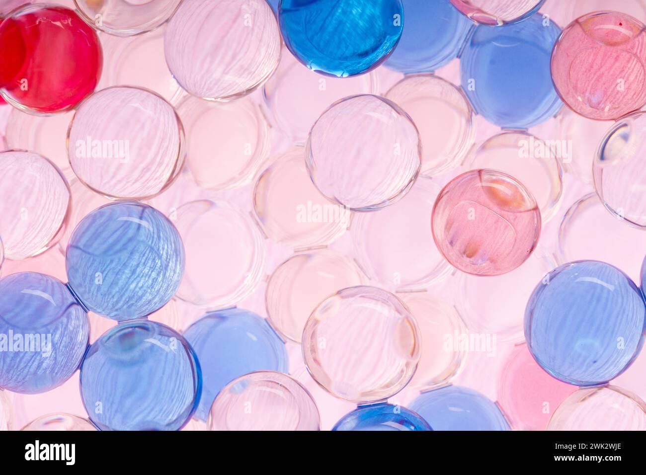 Blue, pink and transparent crowded bubbles composing a colorful ...