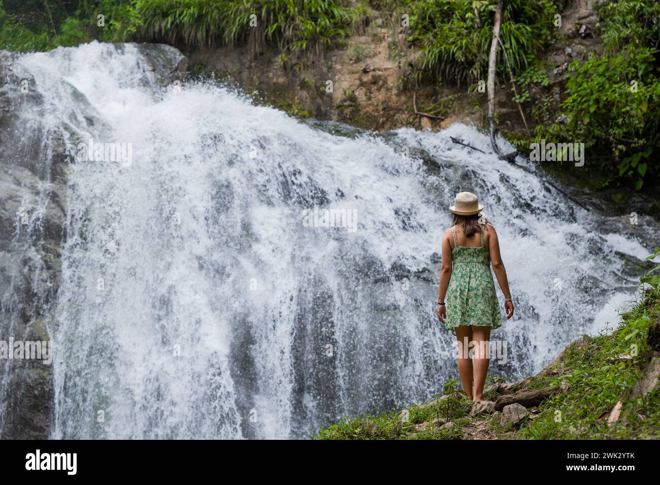 Woman traveler contemplates a waterfall in the Peruvian jungle Stock ...