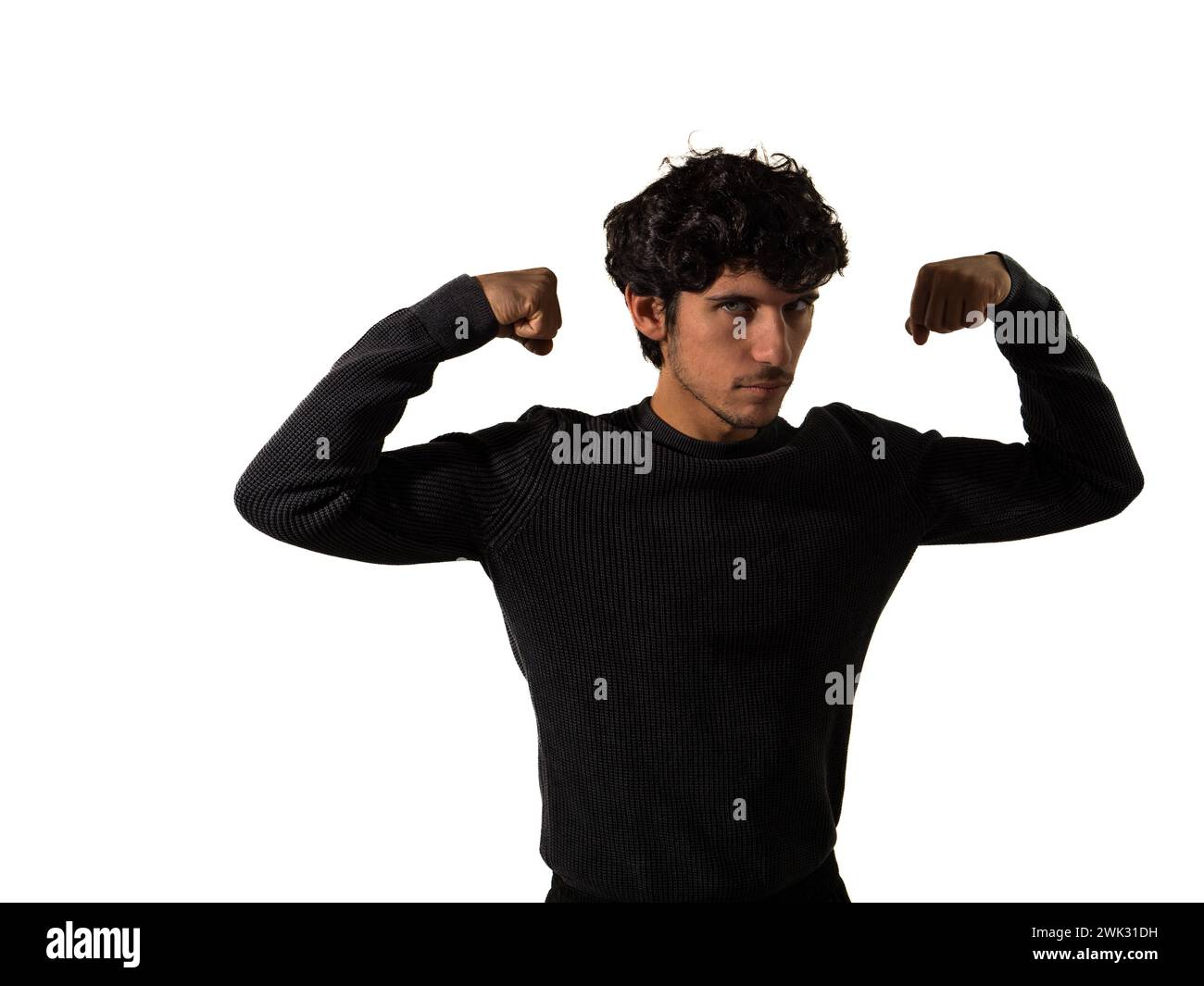 A man wearing a black sweater and pants is shown flexing his muscles in ...