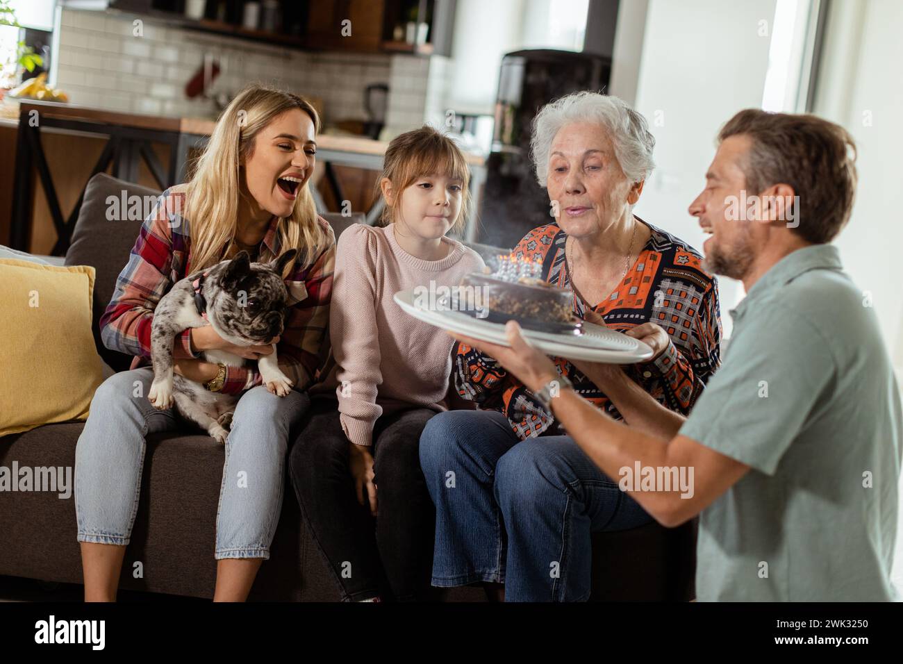 Heartwarming scene unfolds as a multi-generational family gathers on a ...