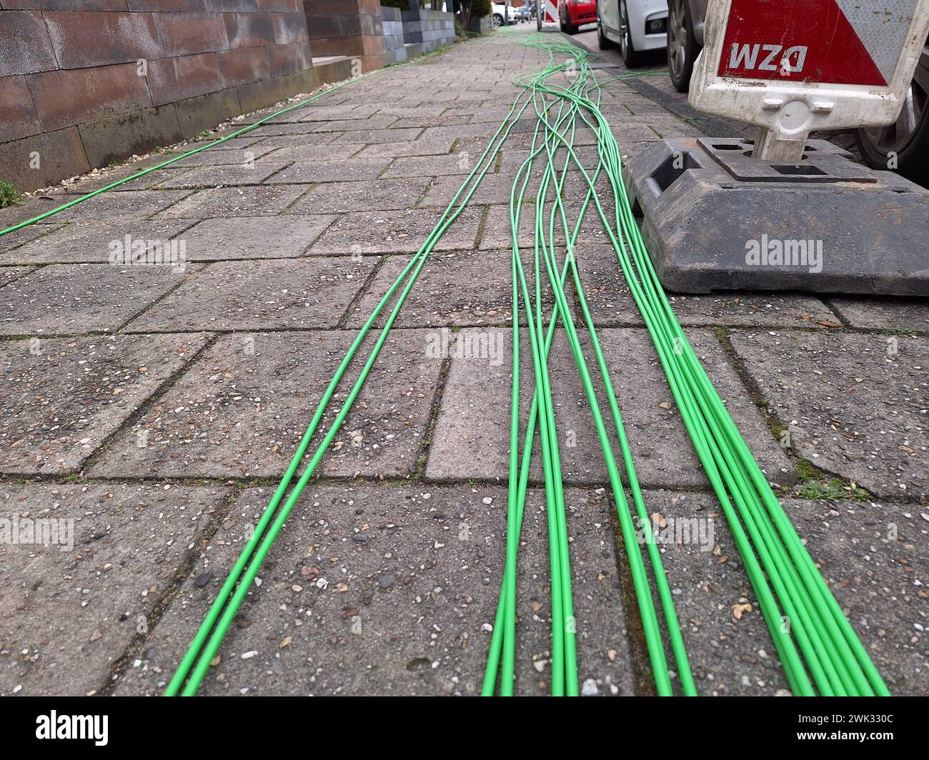 Fibre optic cables ready on the pavement to be buried for high-speed ...