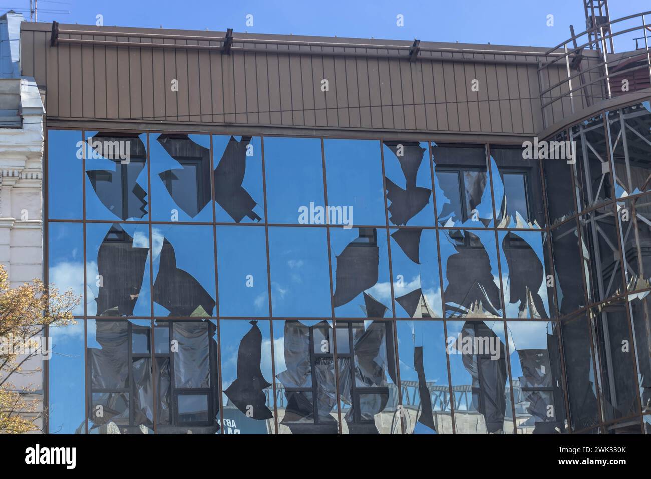 Broken glazing of a building facade as a result of an air wave from a ...
