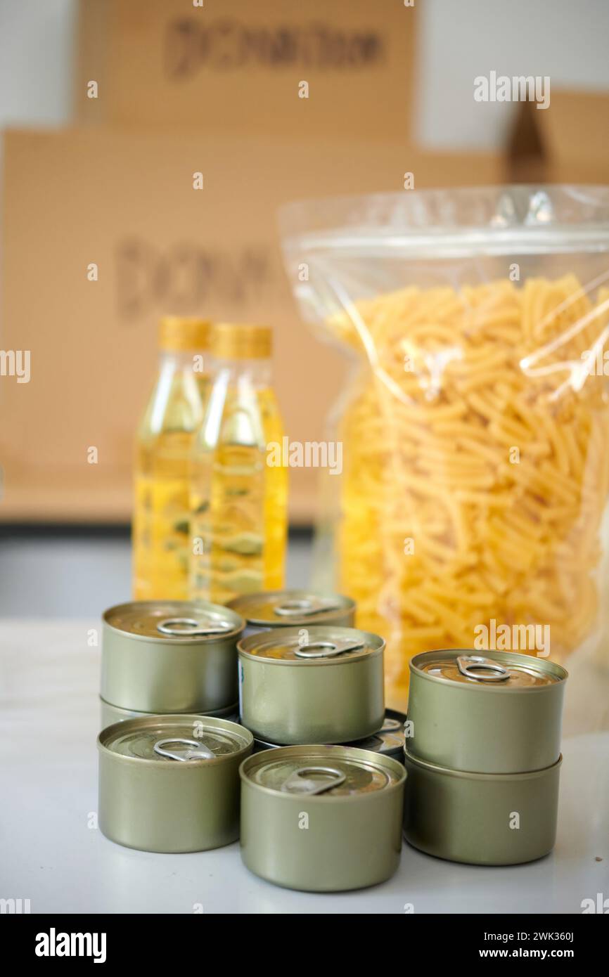 Canned food, big package of macaroni and vegetable oil prepared for ...