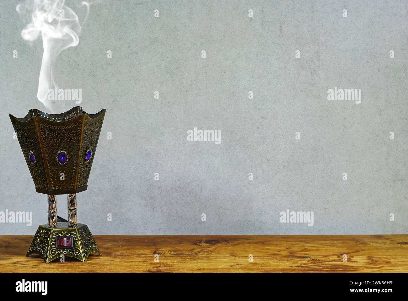 censer incense burner on wood table for ramadan and eid El fitr Stock ...