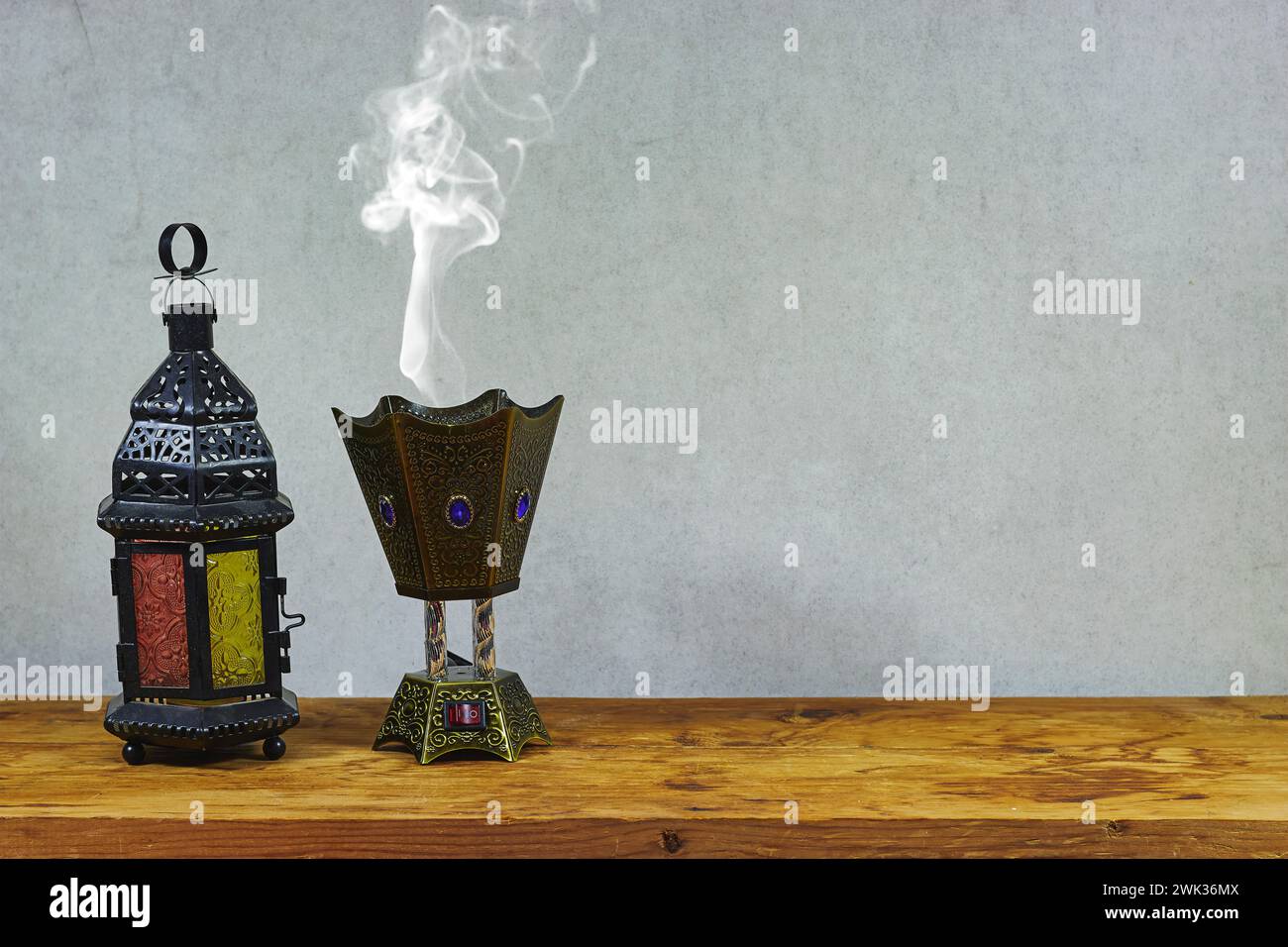 arabic lantern and censer incense burner on wood table for ramadan and ...