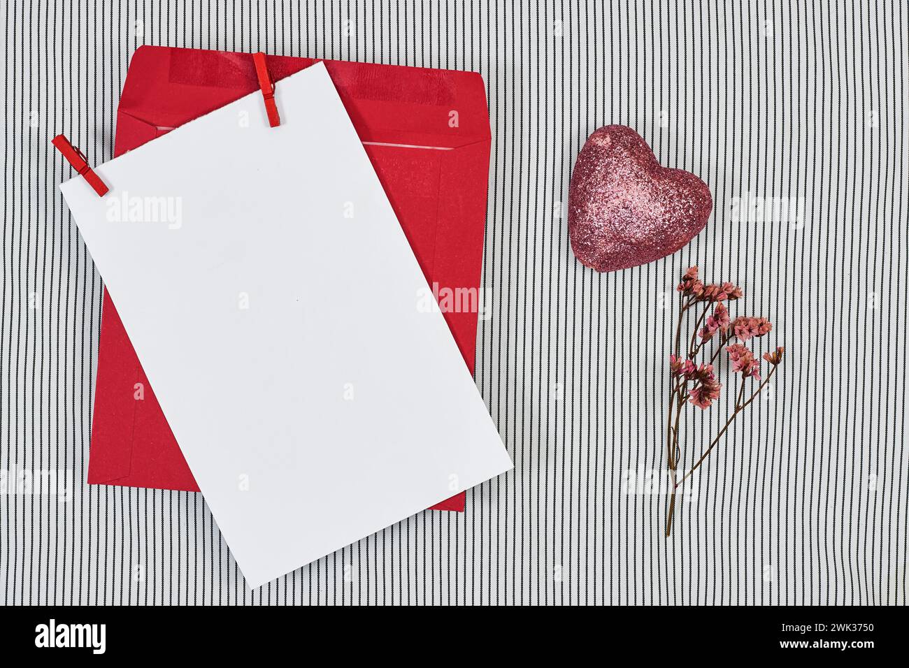 Blank greeting card, flyer or invitation card mockup with red peg and ...