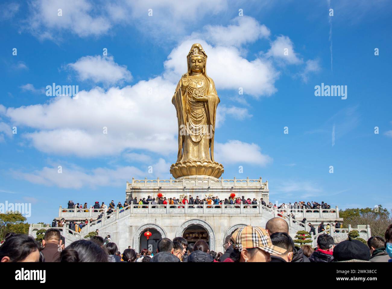 ZHOUSHAN, CHINA - FEBRUARY 16, 2024 - Tourists view the Statue at Mount ...