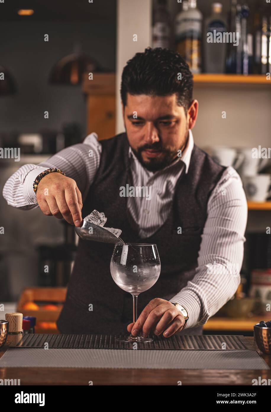Barman stirring ice cubes hi-res stock photography and images - Alamy