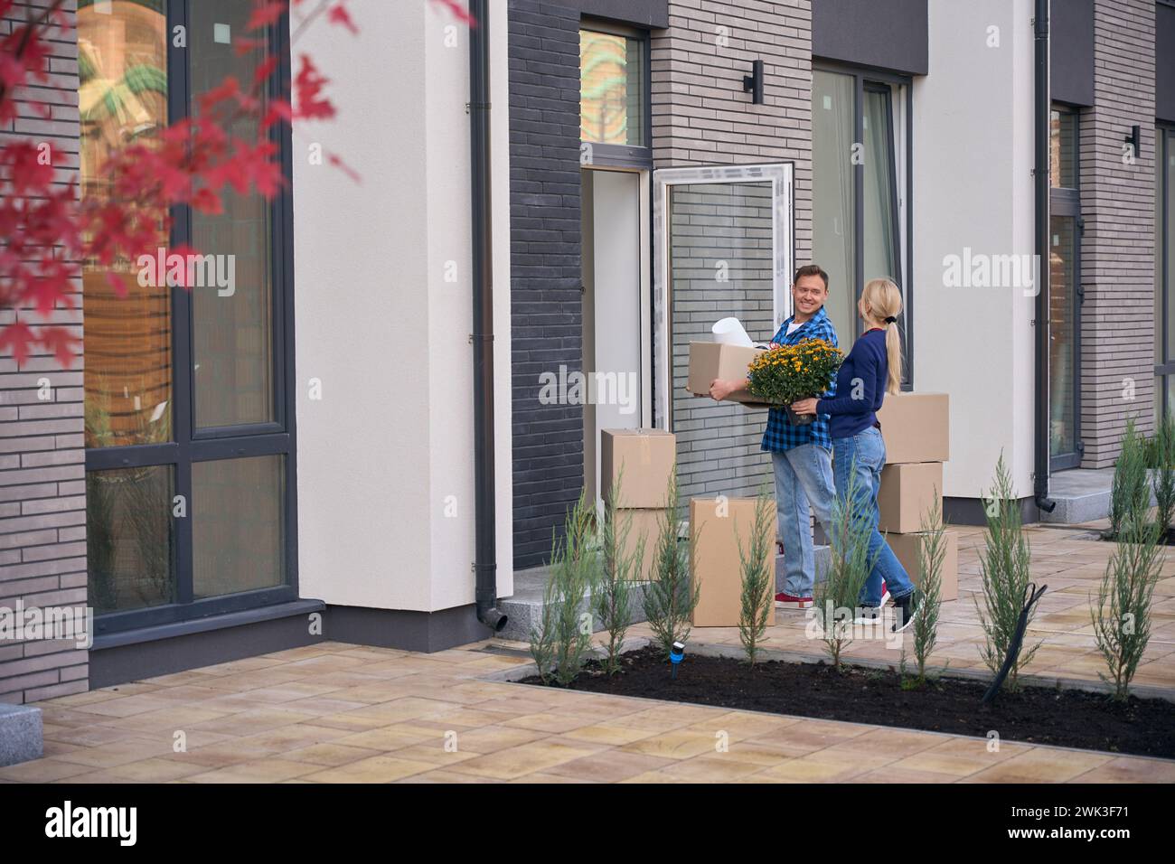 Couple entering house hi-res stock photography and images - Alamy