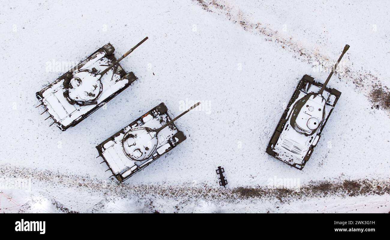 Aerial view of snow-clad tanks in Poznań Citadel during winter, shot by ...