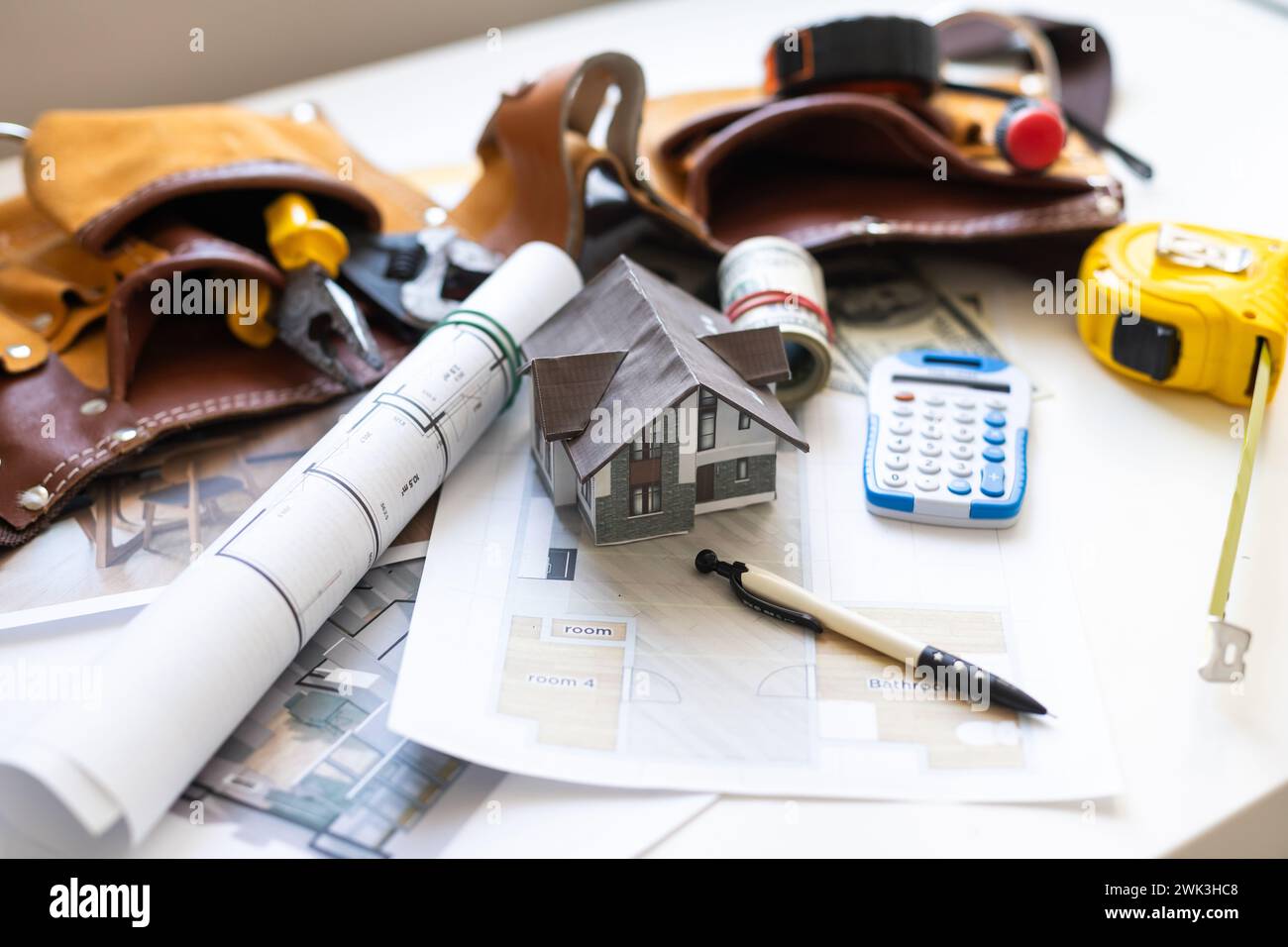 building house on blueprints with worker - construction project Stock ...