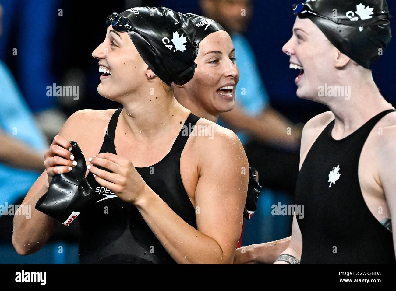 Doha, Qatar. 18th Feb, 2024. Athletes of team Canada react after ...