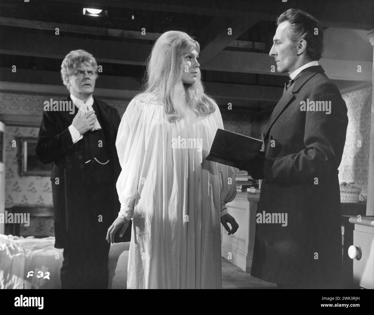 THORLEY WALTERS, SUSAN DENBERG and PETER CUSHING in a scene from ...