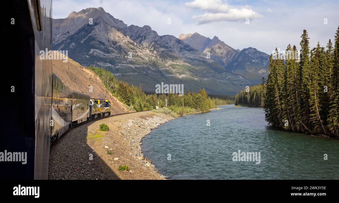 Rocky Mountaineer luxury train rounding bend along the Fraser River in ...