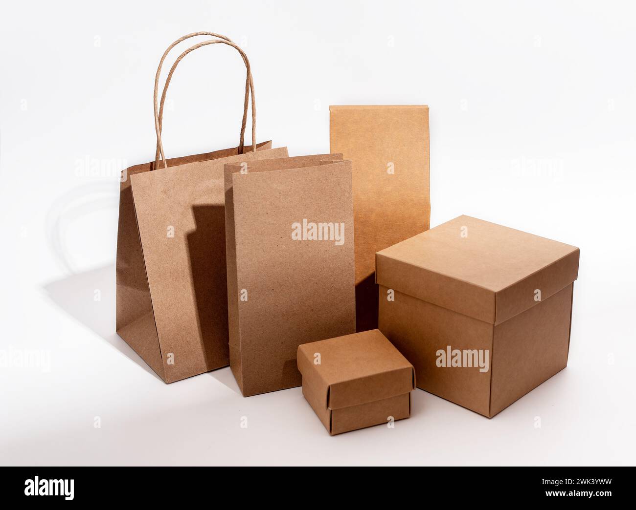 Kraft paper and cardboard packages mockups. Carton packs arrangement ...