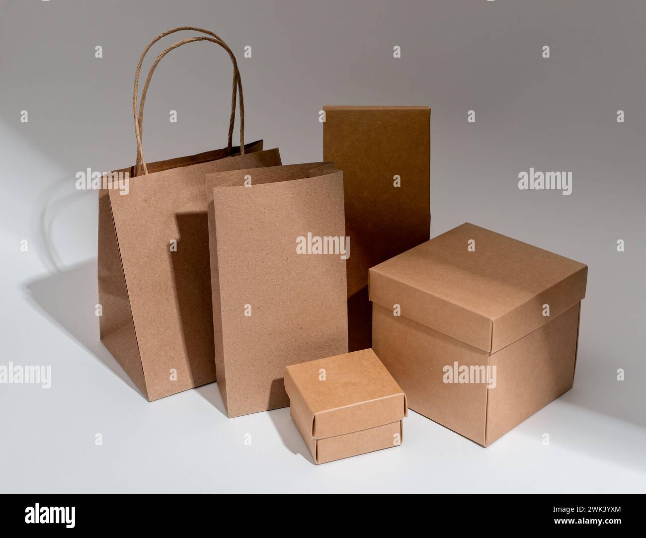 Kraft paper and cardboard packages. Craft carton packs of different ...