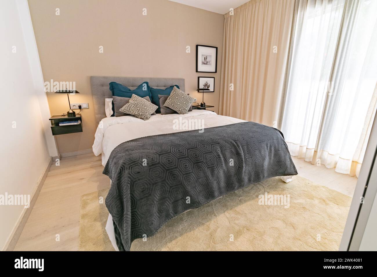 an image of a double bed in a guest bedroom in luxury apartment Stock ...