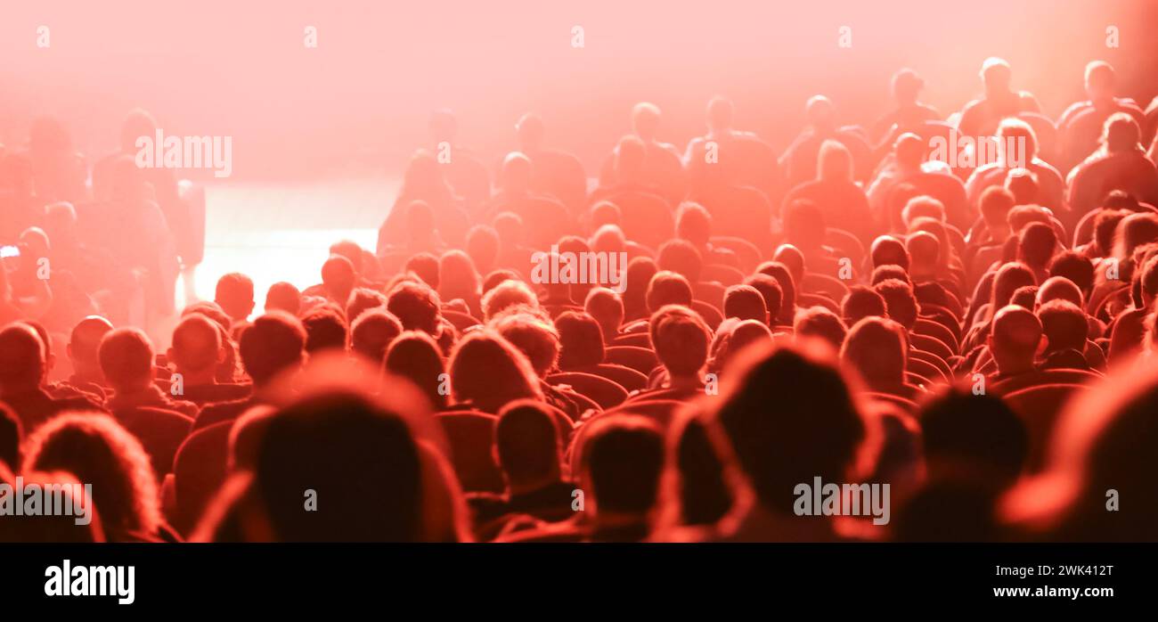 many heads of people during live concert and red lights Stock Photo - Alamy
