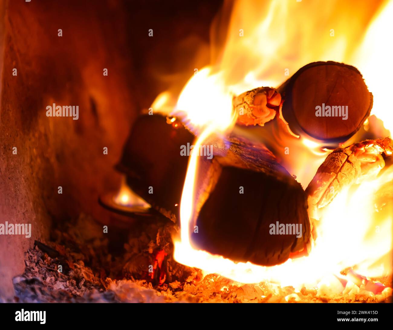 wood burning inside the ancient stove to heat the house or dishes Stock ...