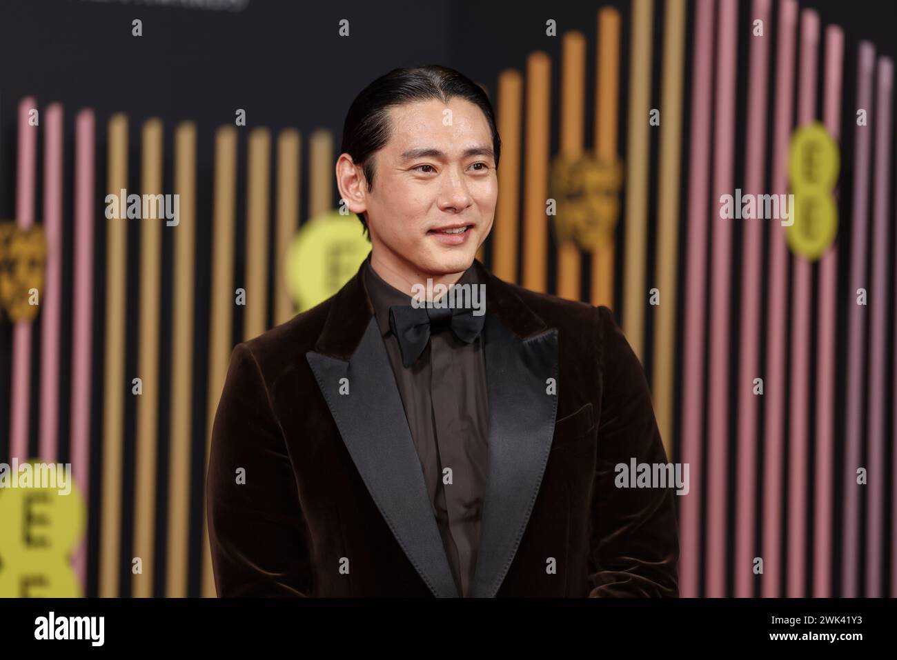 Teo Yoo poses for photographers upon arrival at the 77th British ...