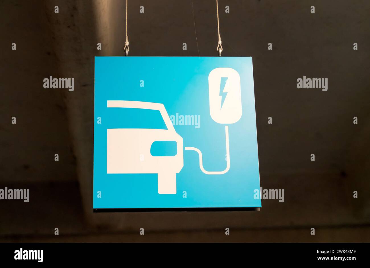 EV electric vehicle charging station sign in parking space Stock Photo ...