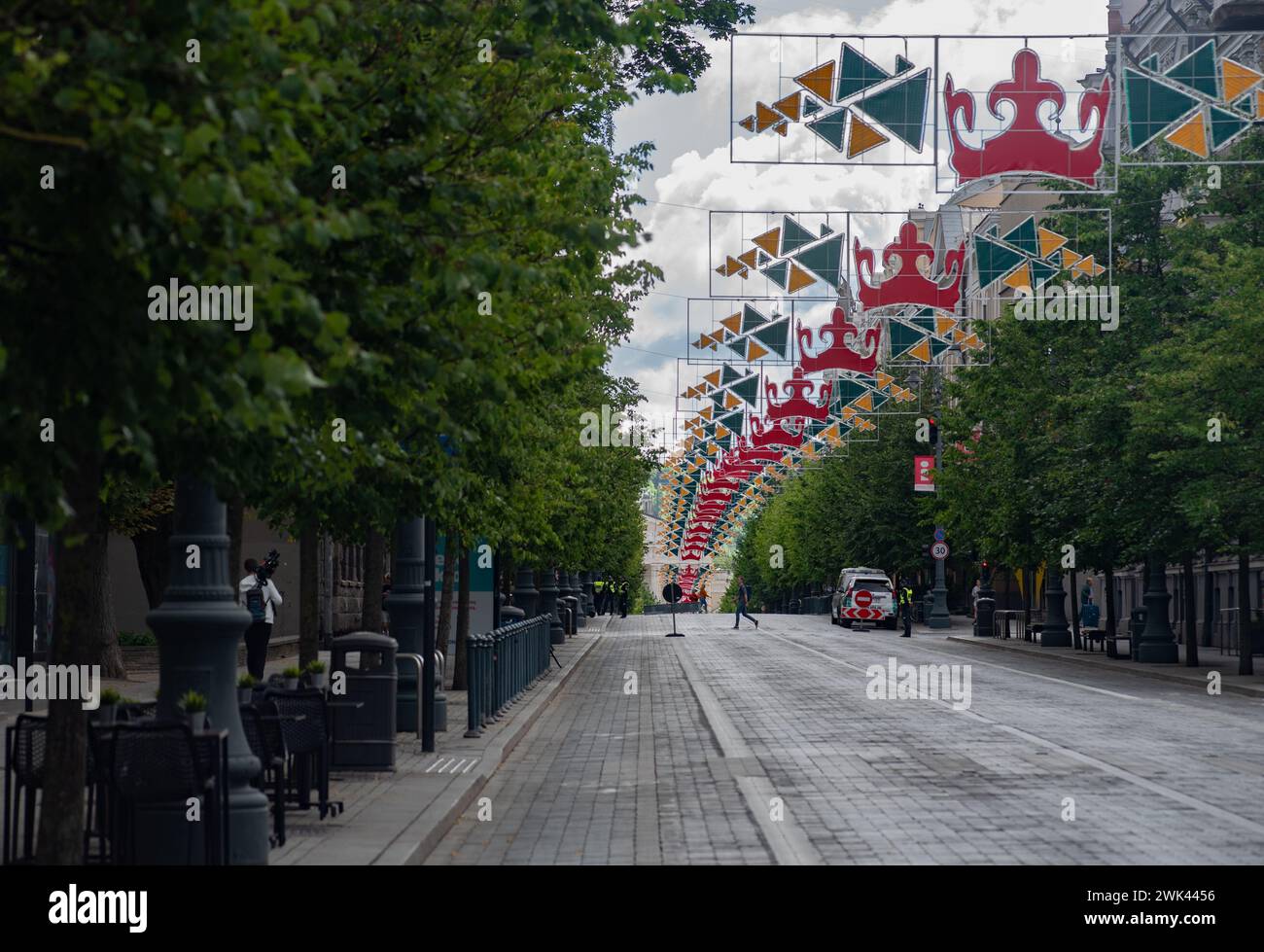 Road flanked by flags, buildings, and trees Stock Photo - Alamy Road flanked by flags, buildings, and trees Stock Photo - Alamy