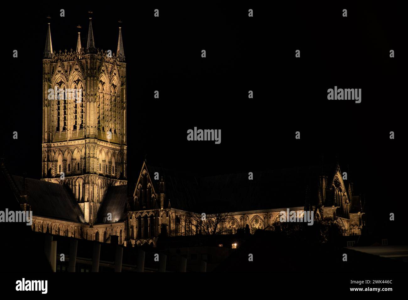 Nighttime illumination of a grand cathedral, adorned with a prominent ...