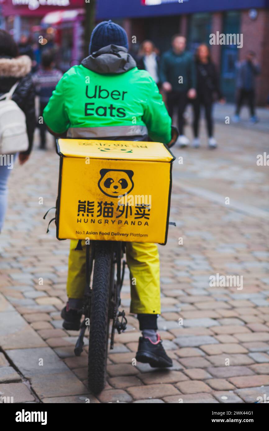 Uber Eats delivery rider on bicycle in daytime Stock Photo - Alamy
