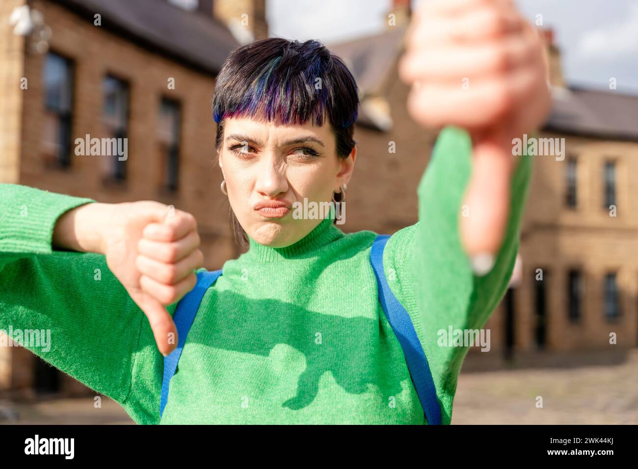 Woman in green sweater showing hi-res stock photography and images - Alamy