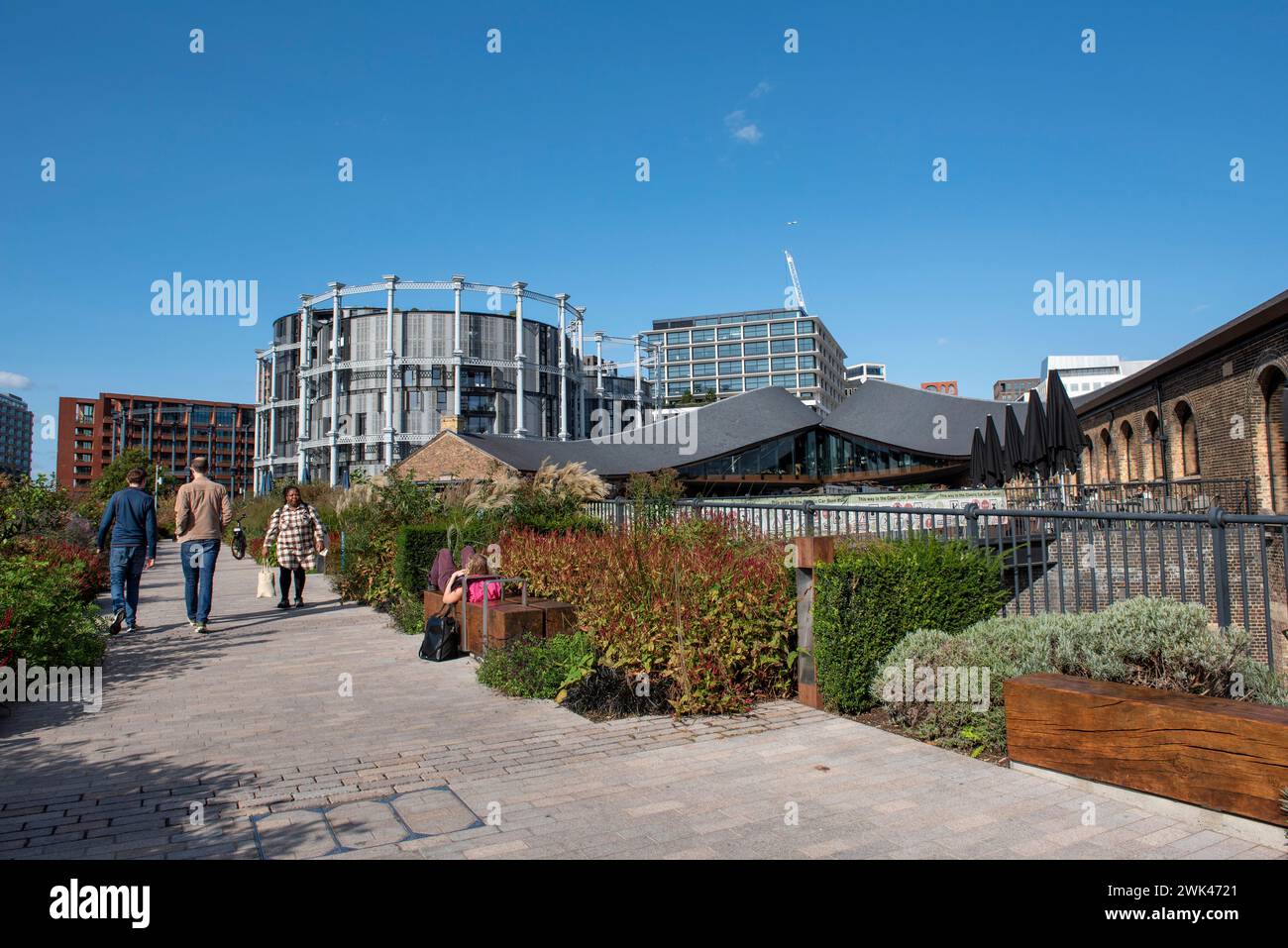 People walking along Bagley Walk, Kings Cross, London Borough of Camden ...