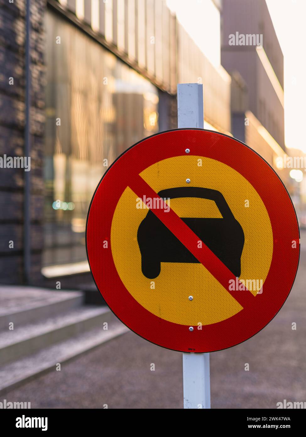 A prominent no entry sign for vehicles is clearly displayed on a metal ...