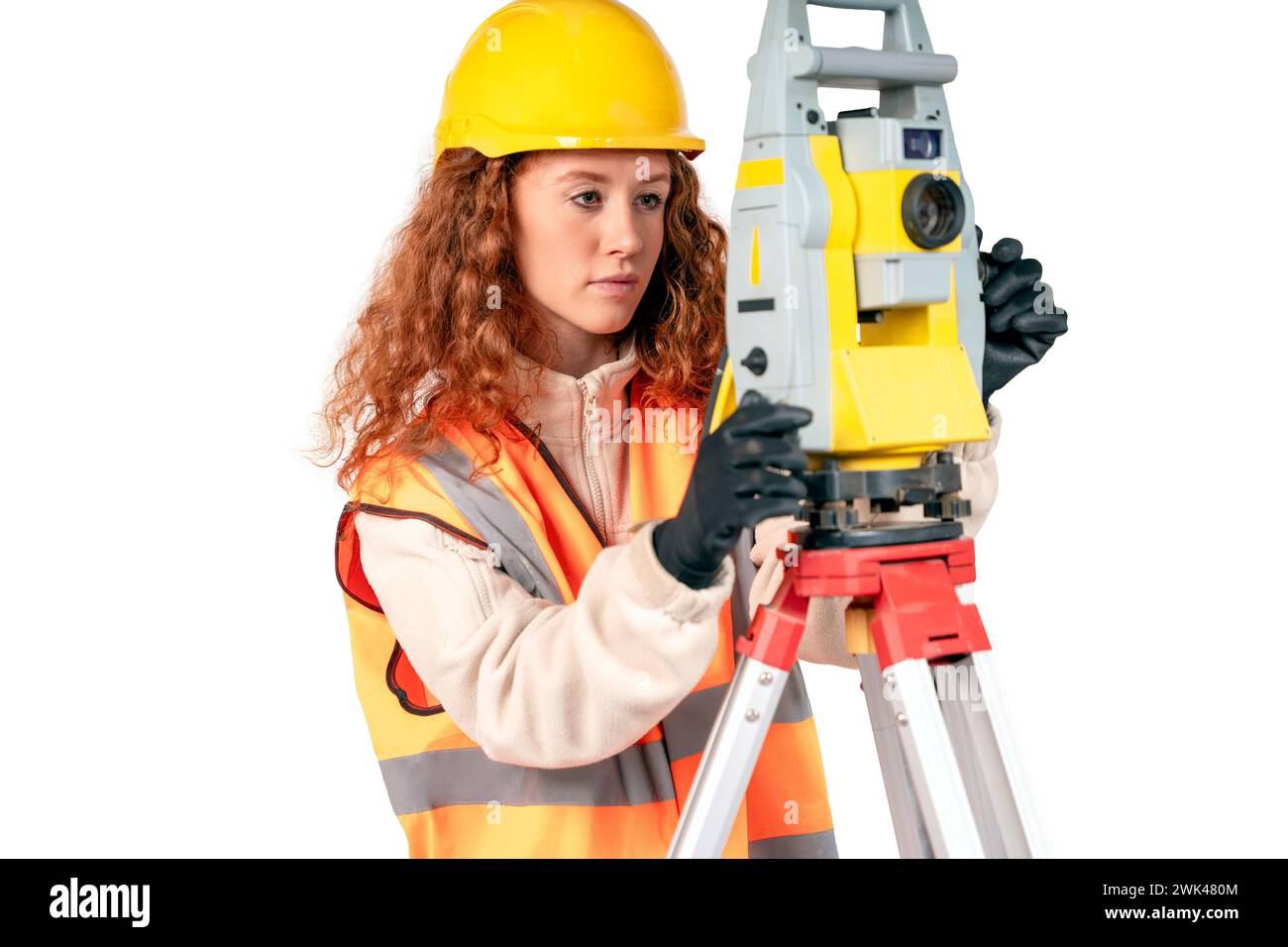 concentrating Woman in hard hat and protective clothes land surveyor ...