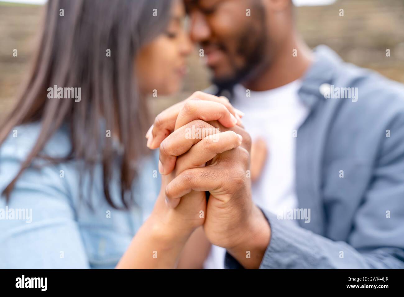 Happy young couple falling in love talking echa other, kissing, hugging ...