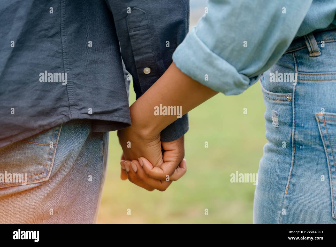 Happy young couple falling in love talking echa other, kissing, hugging ...