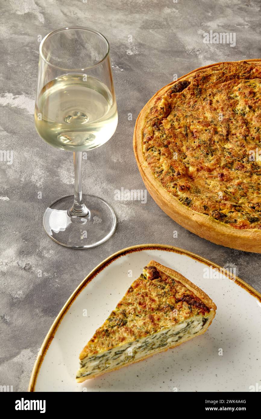 Savory cheese and spinach Quiche Lorraine with white wine Stock Photo ...