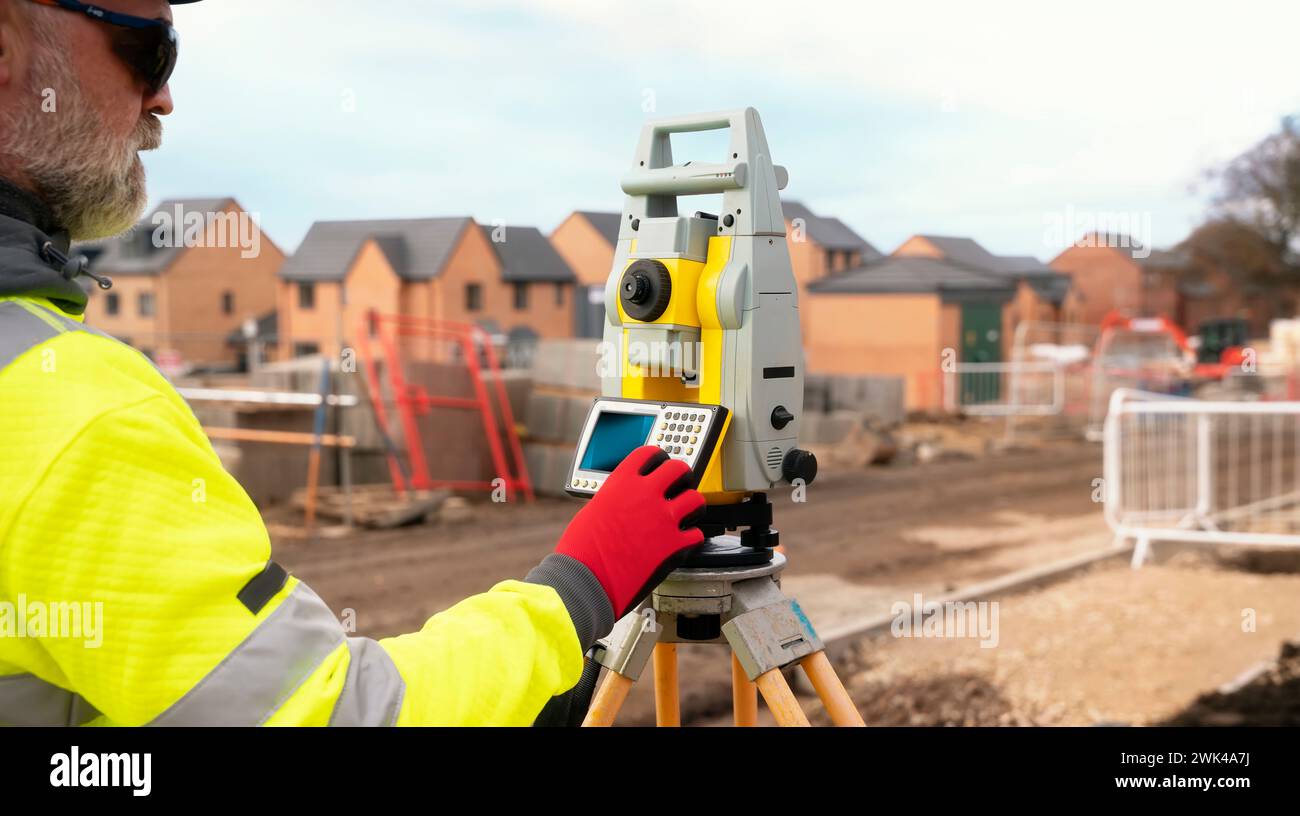 Surveyor builder site engineer with theodolite total station at ...