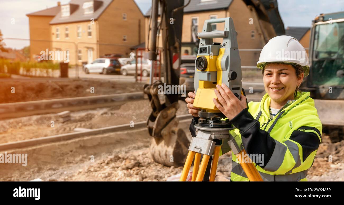 Construction site engineer woman in safety equipment working with ...