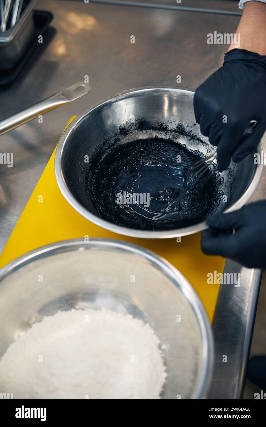 Chef uses cuttlefish ink for natural coloring Stock Photo - Alamy