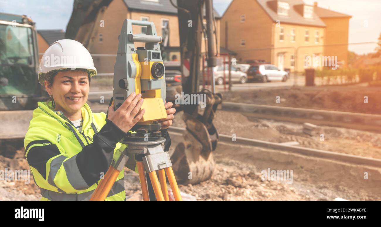 Construction site engineer woman in safety equipment working with ...