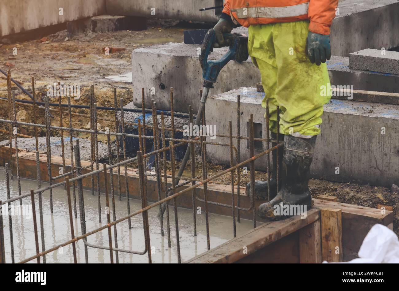 Concrete cast-in-place work. Builder level wet concrete. Concrete works ...