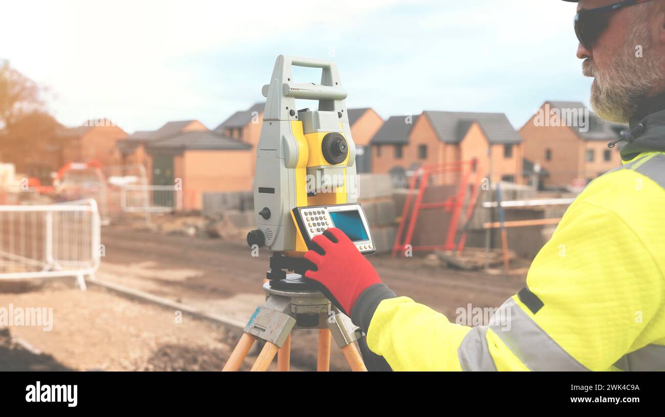 Surveyor builder site engineer with theodolite total station at ...