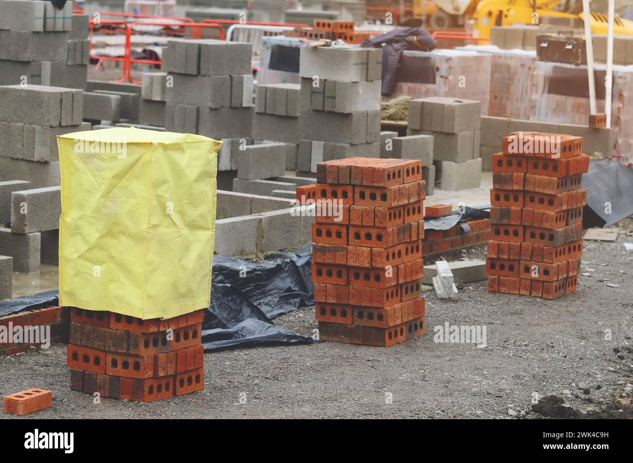 Red bricks and concrete blocks delivered on construction site and ...