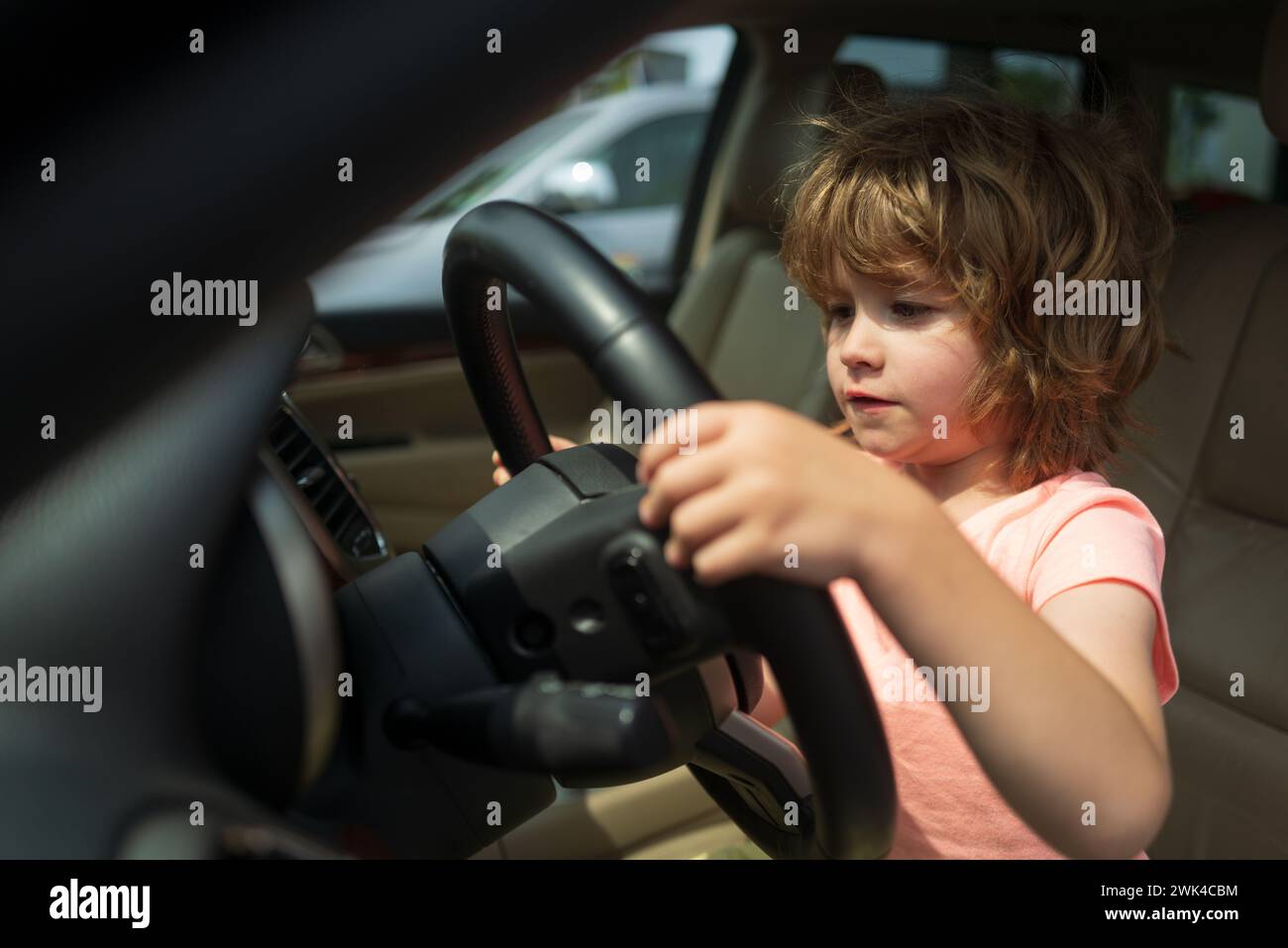Child Driver. Little kid driving car. Kid Are Sitting At The Wheel ...