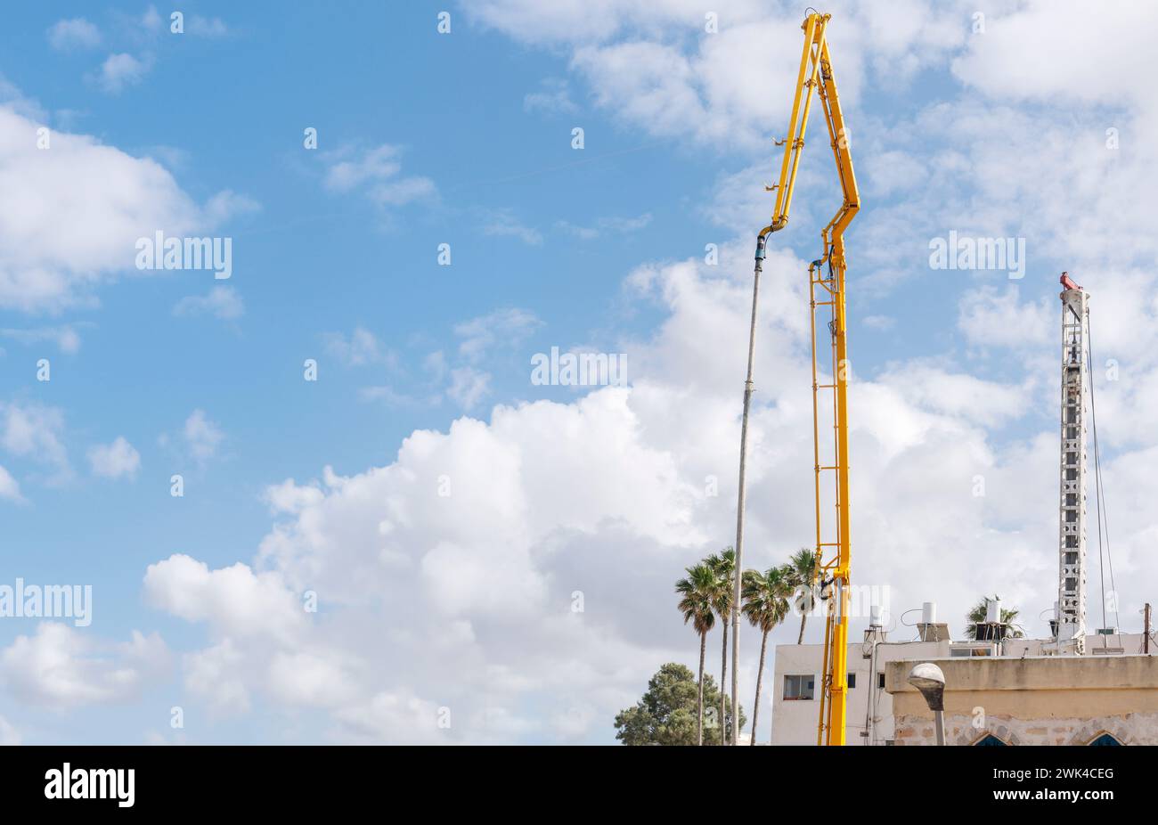 Concrete pump on building site ready to fill the foundation of a ...