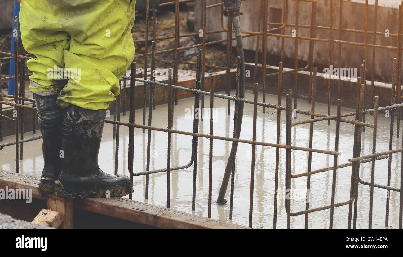 Concrete cast-in-place work. Builder level wet concrete. Concrete works ...