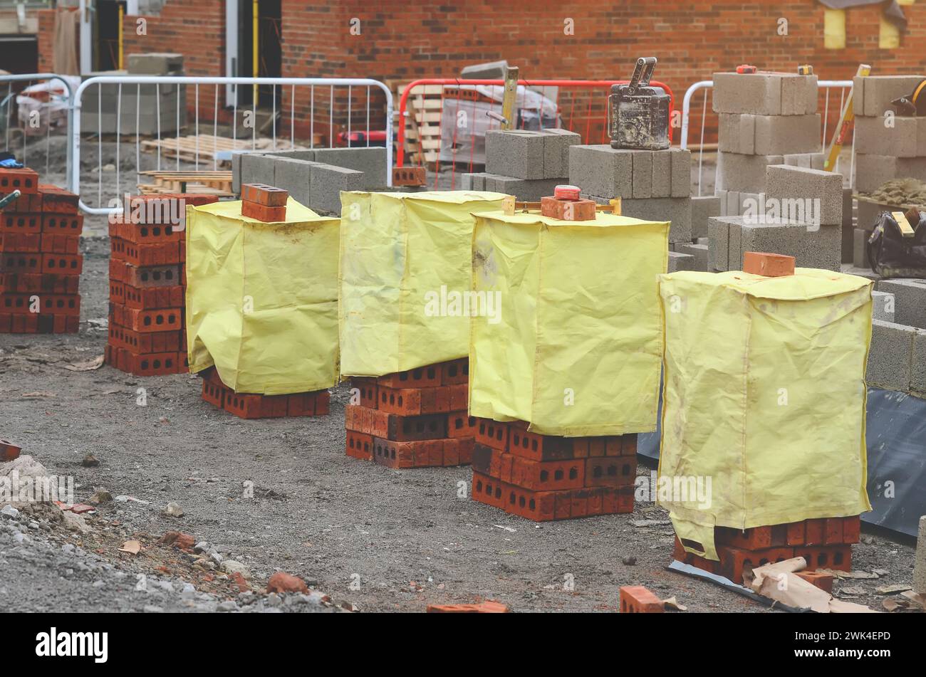 Red bricks and concrete blocks delivered on construction site and ...
